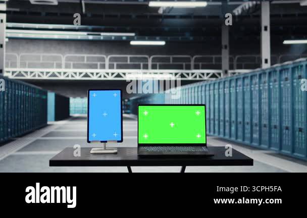 Close up of isolated screen tablet and mockup laptop in data center ...
