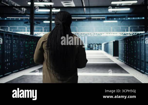 Data center system administrator conducts security audits to protect against cyber threats. IT ...