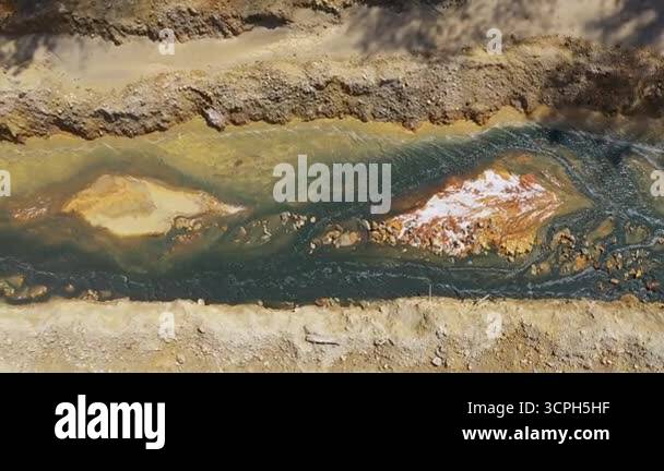 Aerial view of flowing lime and acid mine drainage reaction, water ...