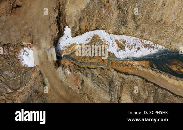 Aerial view of flowing lime and acid mine drainage reaction, water ...