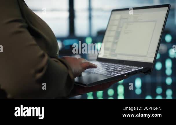 Close up of software developer working in data center to optimize ...