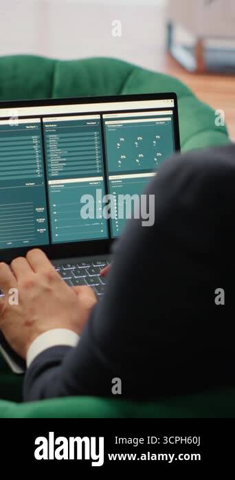 Vertical Video Determined CEO works in office analyzing infographics ...