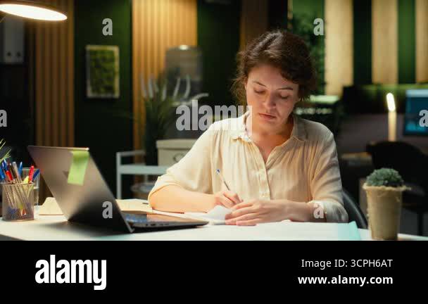 Livid businesswoman breaking a paper page after making a mistake ...