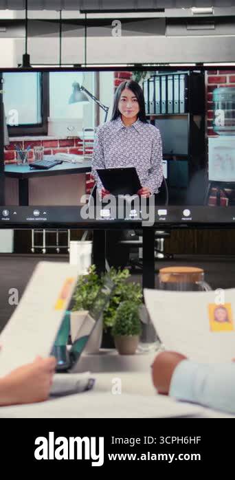 Vertical Video Diverse HR staff hosting a virtual meeting to interview ...