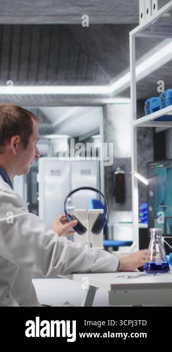 Vertical Video Unconventional scientist listens to music while ...