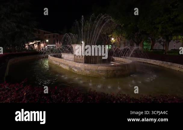 Rovigo, italy 10 september 2025: water jets illuminate the night in ...