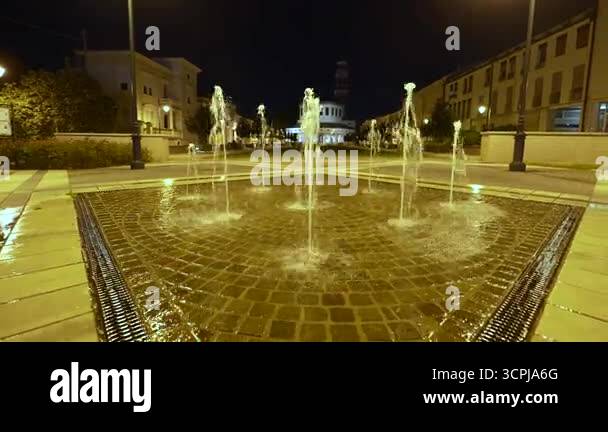 Rovigo, italy 10 september 2025: water jets illuminate the night in ...