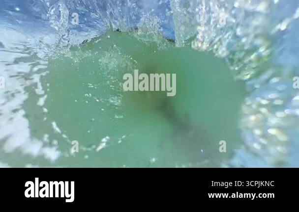 Slow Motion, Man and Woman Passing Object Over Water Surface With Tiny ...