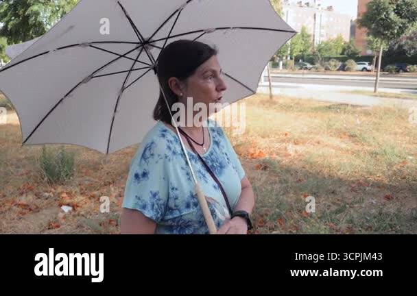 Woman umbrella heat sun Stock Videos & Footage - HD and 4K Video Clips ...