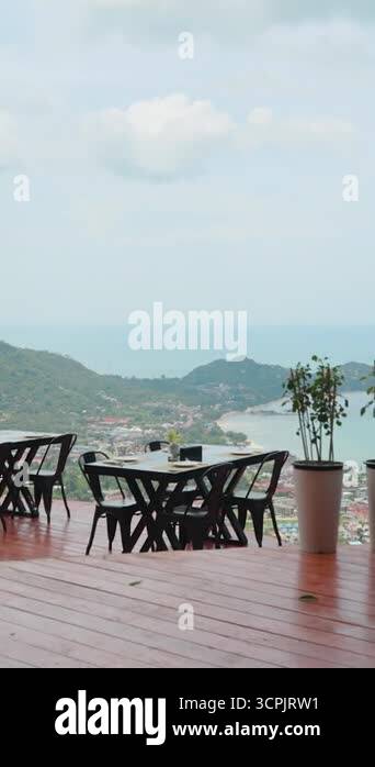 Vertical video. Outdoor Restaurant Terrace With Black Tables and Chairs ...
