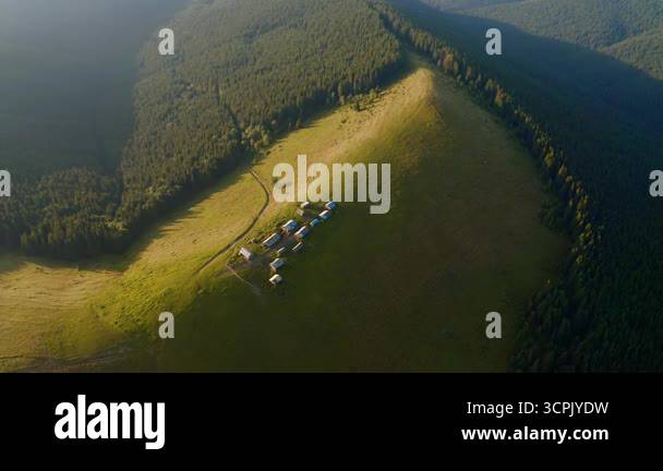 Alpine mountain settlement from a bird's eye view on a summer day ...