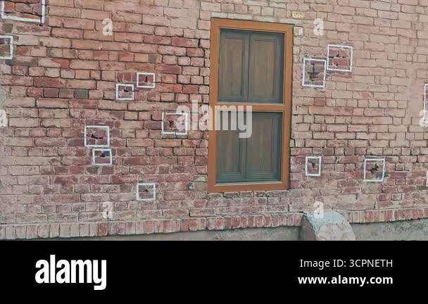 Close-up of the bullet-riddled wall at Jallianwala Bagh, Amritsar. The ...