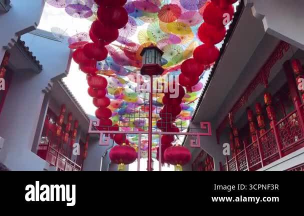 Footage walkthrough beautiful colorful Chinese oriental umbrellas and ...