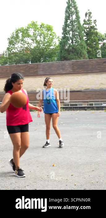 Amateur basketball players practice dribbling, passing, and shooting ...