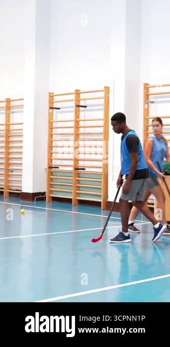 Professional hockey players practice dribbling and stick handling ...