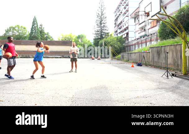 Multiple shots capture basketball players practicing shooting ...