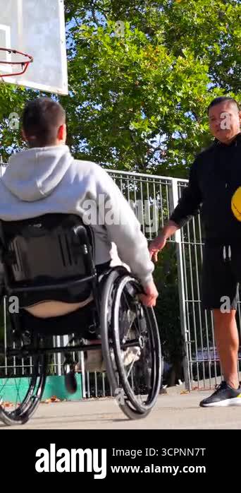 Two friends with disabilities, one in a wheelchair and one with a ...