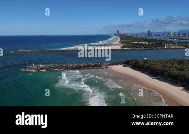 4K aerial drone footage showing Wave Break Island, golden sandy beaches ...