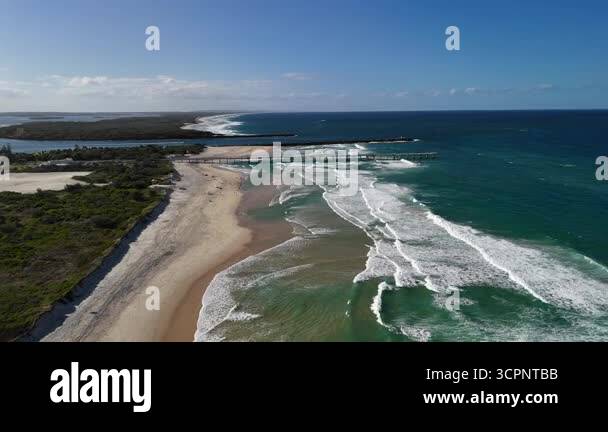 4K aerial drone footage showing Wave Break Island, golden sandy beaches ...