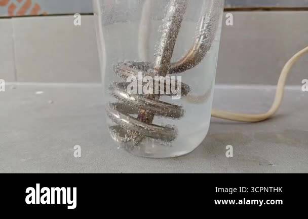 boiling water in a plastic cup Stock Video Footage - Alamy