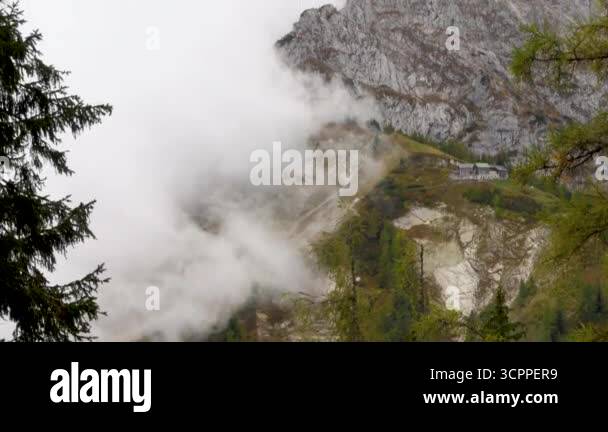 Alps mountains caught in dense fog at Rossfeld Panorama Strasse in ...