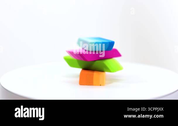 Stack of new colorful erasers on white background Stock Video Footage ...