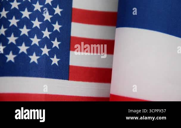 A close up clip of the USA national flag together with the French ...