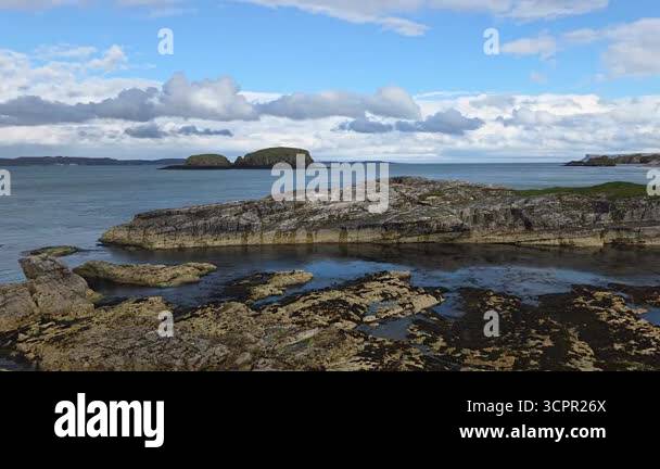 Time lapse of a dramatic Irish seascape with rugged cliffs, striking ...