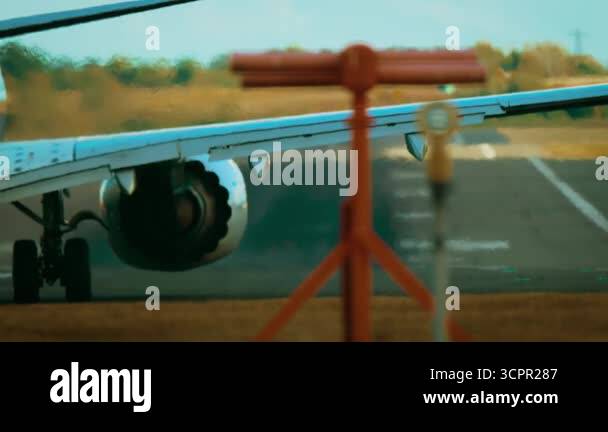 Aircraft warming turbines and starting takeoff roll on runway. Jet ...