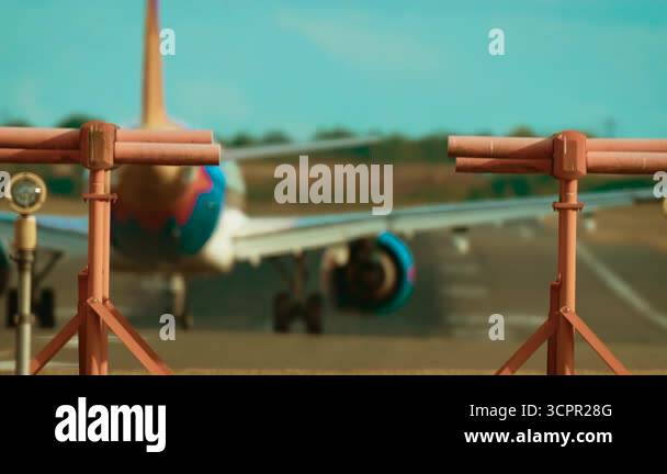 Jetliner accelerating on runway with turbines spinning fast and tail ...