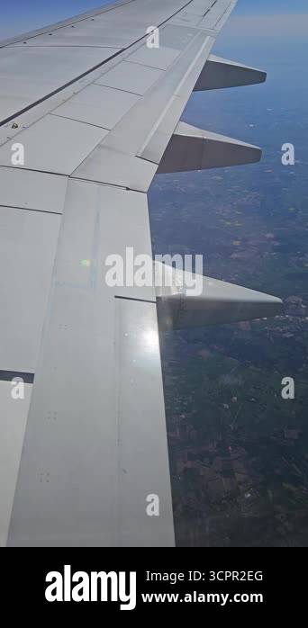 Aeroplane flying above dark green agricultural region. Aircraft ...