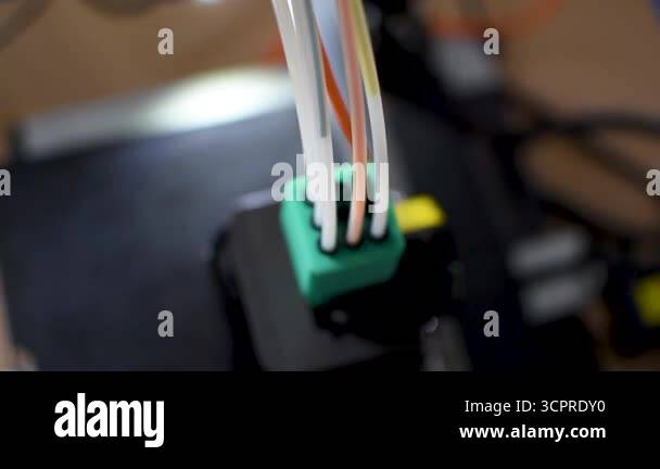 3d printer printing an object on the tray with pla filament, corn ...