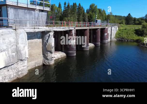 An old dam nearing the end of its life reveals its curved steel plates ...