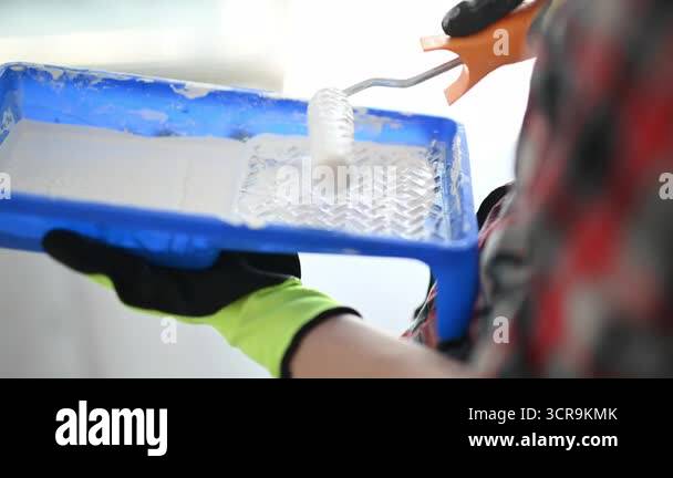 Woman With Roller Brush And Tray Getting Ready To Paint Walls White ...