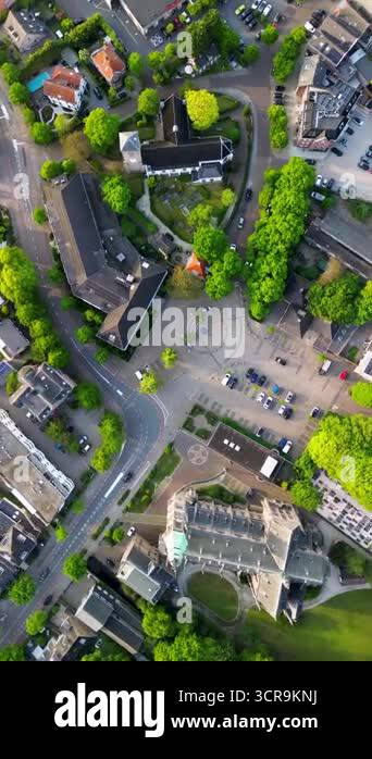 Aerial view of a town block with a central plaza, multi-story buildings ...