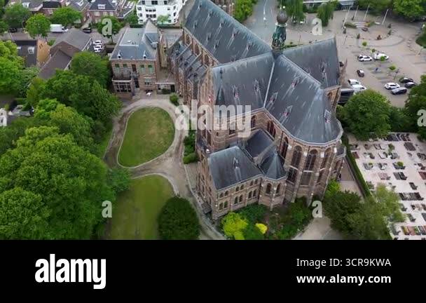 Aerial view of a grand Gothic style building with pointed arches, tall ...