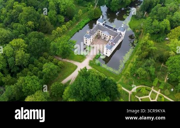 Aerial view of a rectangular, four tower castle surrounded by a moat ...
