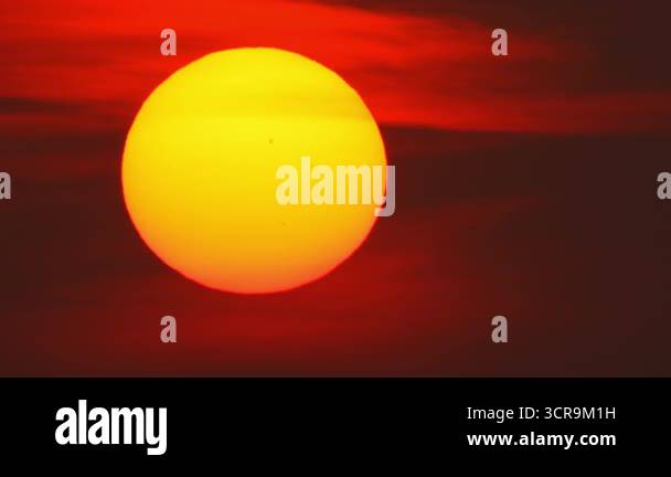 Cinematic sun set with red yellow and orange sky timelapse. Yellow sun ...
