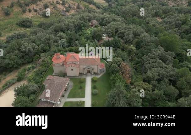 Aerial drone shot slowly tilting down on the monastery of san pedro de ...