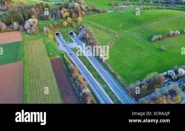 Small rural European town with highways and roads, agricultural fields ...