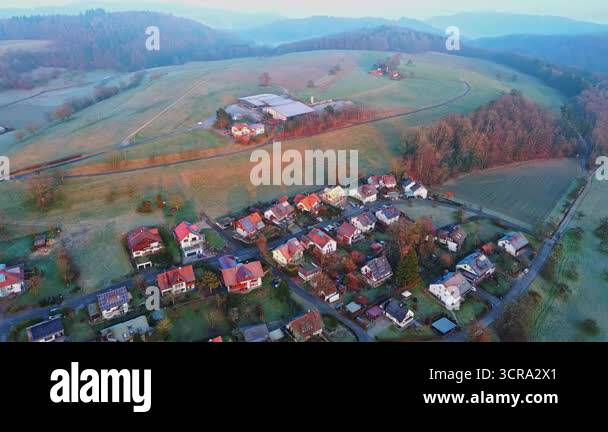 A small village with old houses, agricultural farms, highways, green ...