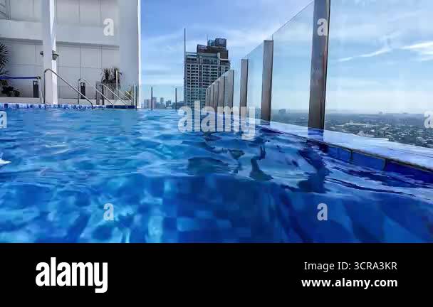 View point from a pool overlooking Manila Makati district in the ...