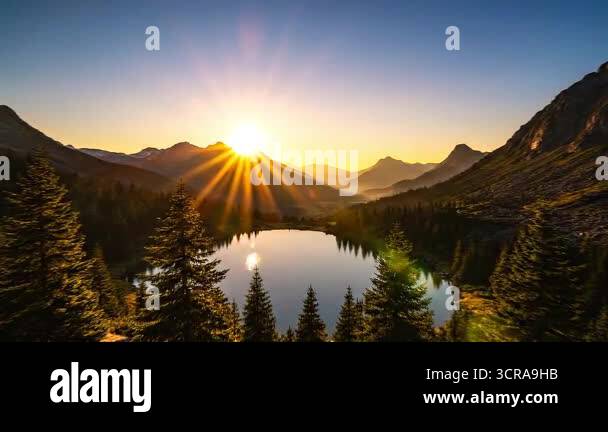 Sunrise timelapse horizontal video, the sun rising behind the mountains ...