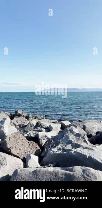 Walking along the rocky Iceland coast, beautiful view of the sea and ...