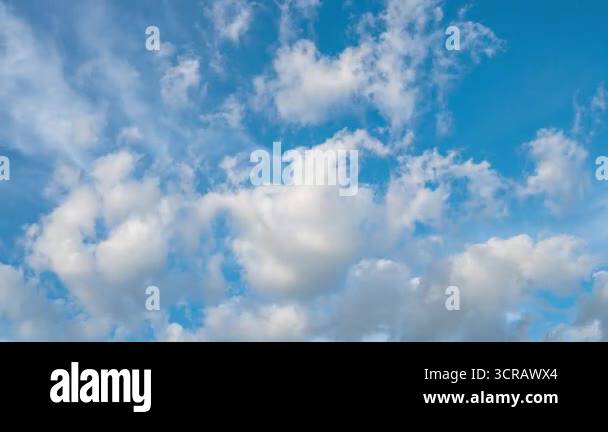 Building motions clouds. Puffy fluffy white clouds sky time lapse. slow ...