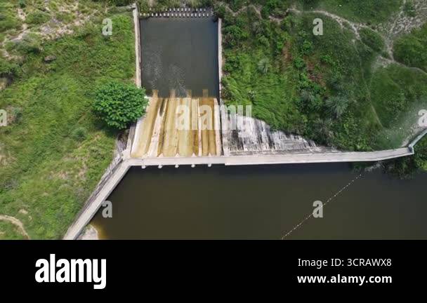 aerial top view of dam spillway with net protection system for fish ...