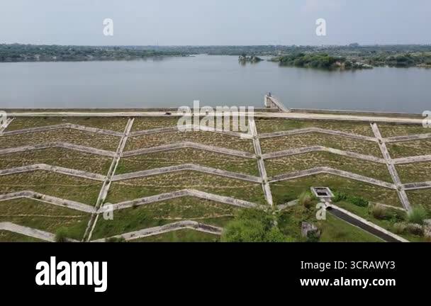 Panoramic view of small dam lake in countryside showing water reservoir ...