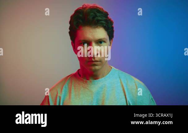 Angry Portrait of Young 20s Man with Unhappy Face Looking at Camera in ...