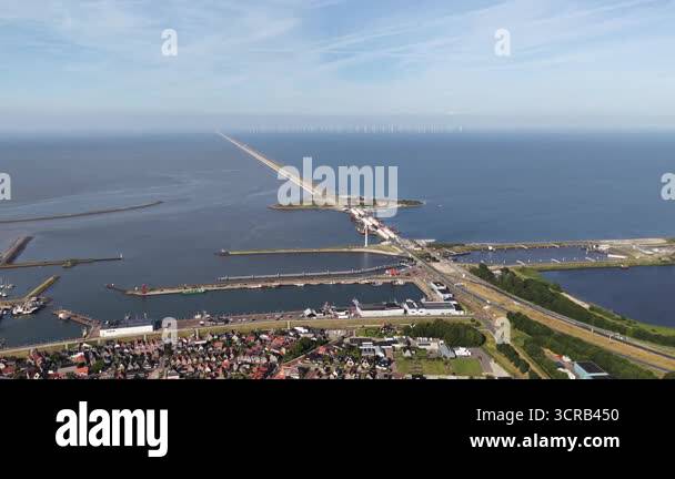 The Afsluitdijk, road and water barrier from Den Oever, North Holland to Kornwerderzand ...