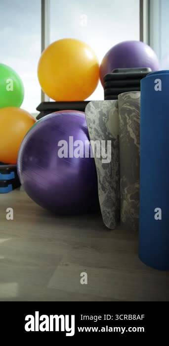 A vibrant collection of fitness equipment, including large exercise ...